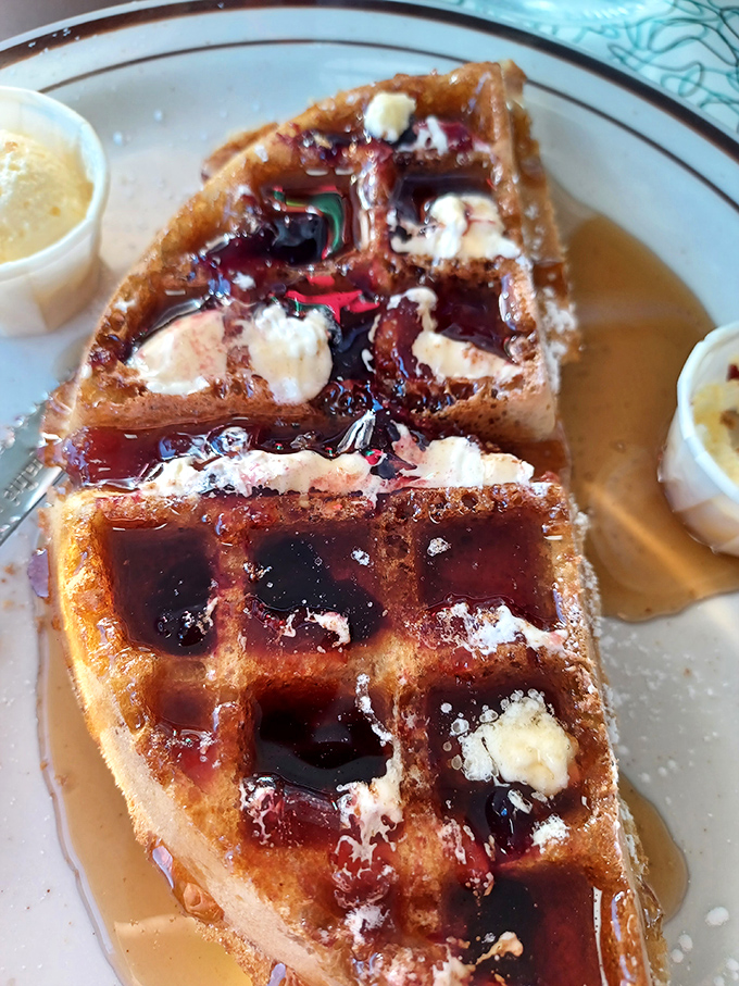 Syrup rivers and butter lakes - this waffle's got more landscape features than a Colorado hiking trail. Grab your fork and explore!
