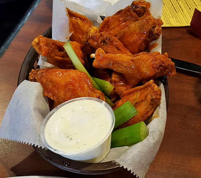 Wing perfection achieved! This basket of golden-brown goodness is like a warm hug for your taste buds. Resistance is futile.