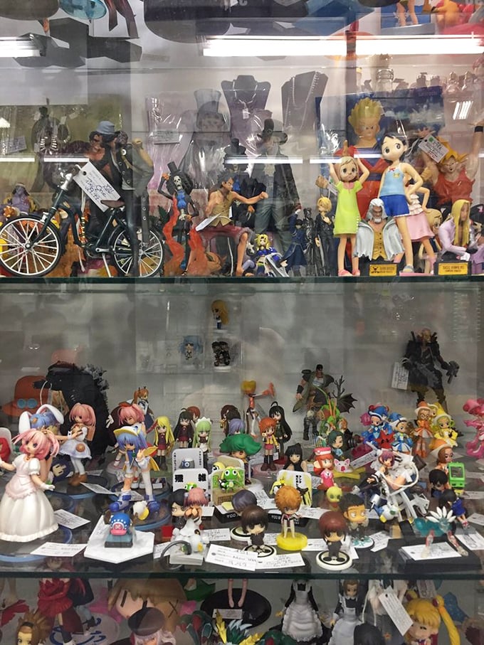 Anime fans, rejoice! This case is packed tighter than a Tokyo subway, with figurines from every era of otaku obsession.
