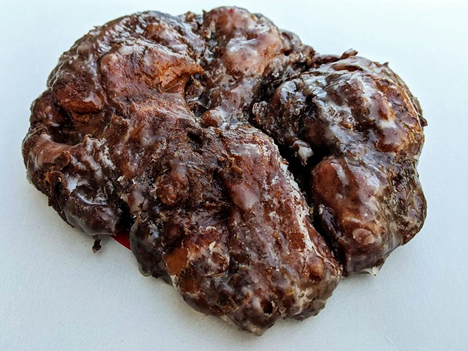 The apple fritter: nature's way of saying "You deserve this." It's like autumn and indulgence had a delicious love child. Go ahead, take a bite of bliss.