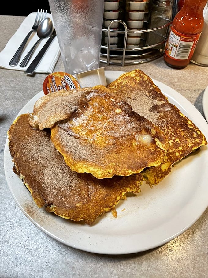 Golden-brown perfection! These pancakes are so fluffy, they might float away if not weighed down by a generous dusting of cinnamon sugar.