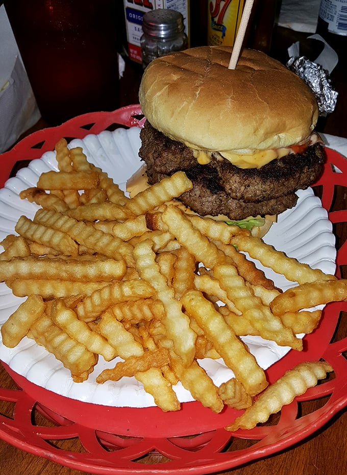 Holy cow! This burger's stacked higher than my college textbooks. It's a towering testament to the power of beef between buns.