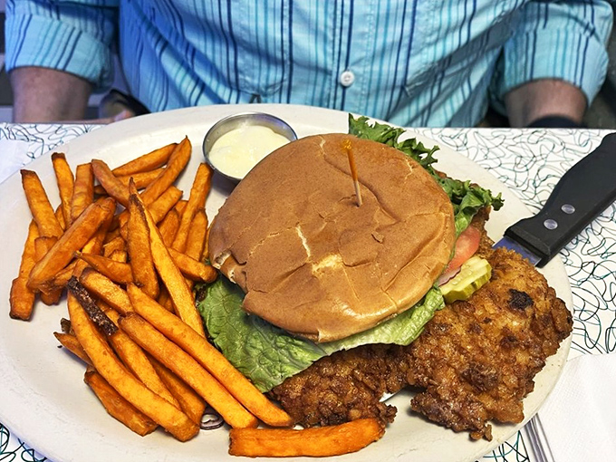 "Now that's what I call a sandwich! This burger is stacked higher than a 1957 Chevy on hydraulics."