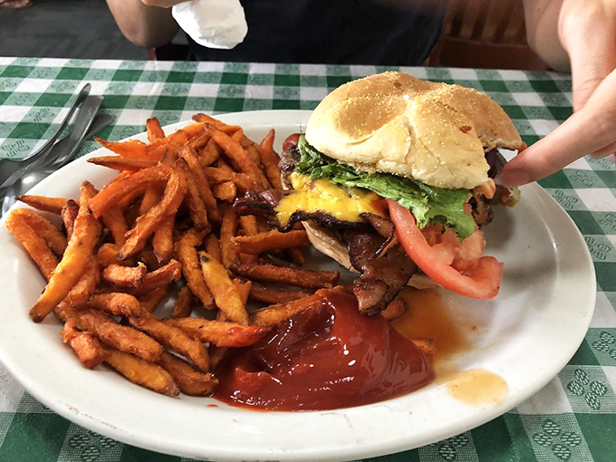 Burger bliss awaits! This towering creation is the Jenga of sandwiches &ndash; a delicious balancing act of flavors that'll have you licking your fingers with glee.
