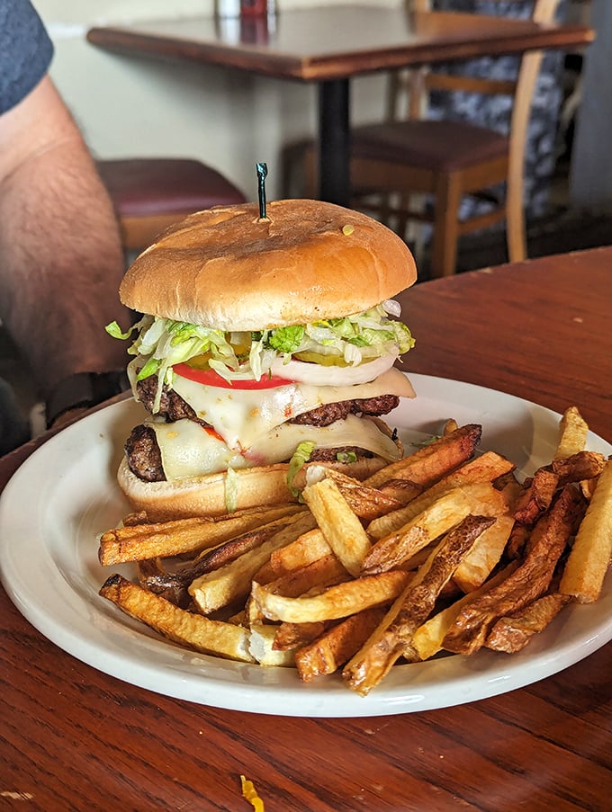 Burger alert! This beauty could make even the Mona Lisa crack a smile. And those fries? Golden perfection.