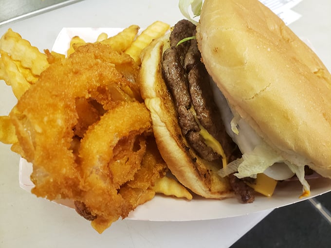 This isn't just a burger&mdash;it's architecture. Those onion rings could double as golden halos for food saints.