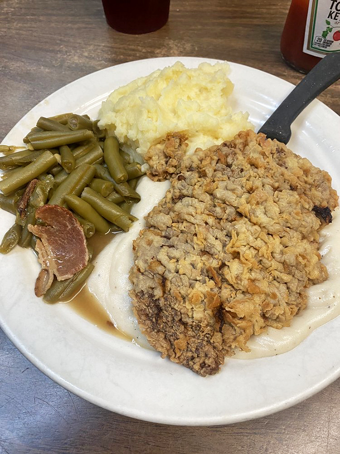 Chicken Fried Steak: Where comfort food meets Texas-sized appetite. This plate could make a vegetarian question their life choices!