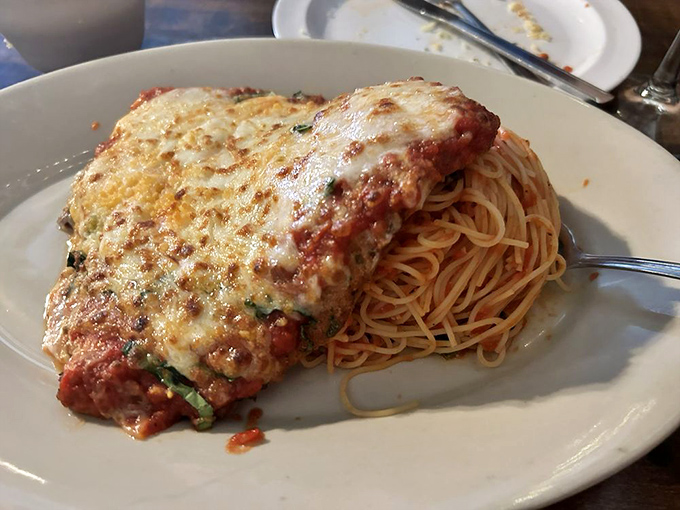 Chicken Parm, you taste so good! This golden-crusted beauty could make even Peyton Manning fumble his fork in excitement.