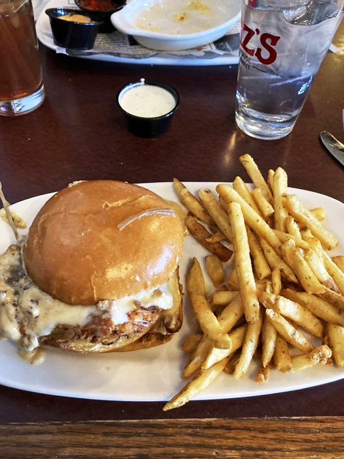 A sandwich that requires strategic eating and possibly a nap afterward. The melty cheese cascade is nature's way of saying "you chose correctly."