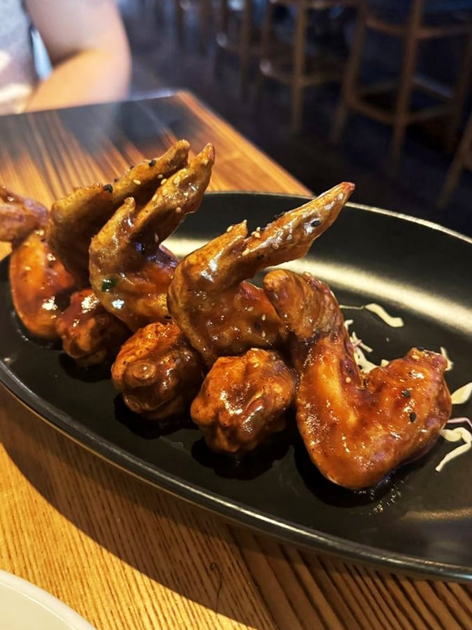 These aren't just wings; they're sticky-fingered, napkin-destroying flavor bombs that make you forget you're in paradise for a delicious moment.