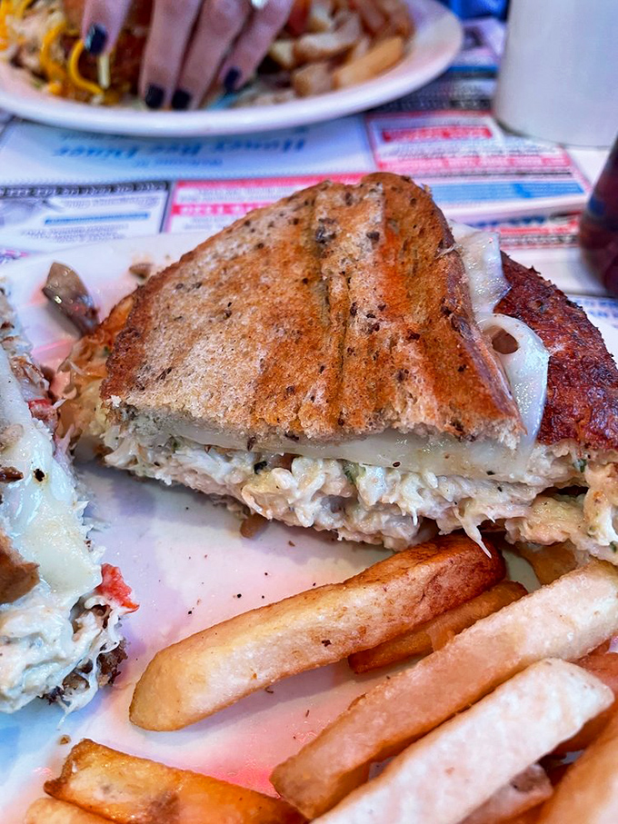 This crab melt sandwich is what happens when the sea meets the grill in a delicious dance. Maryland's finest, served between two slices of heaven.