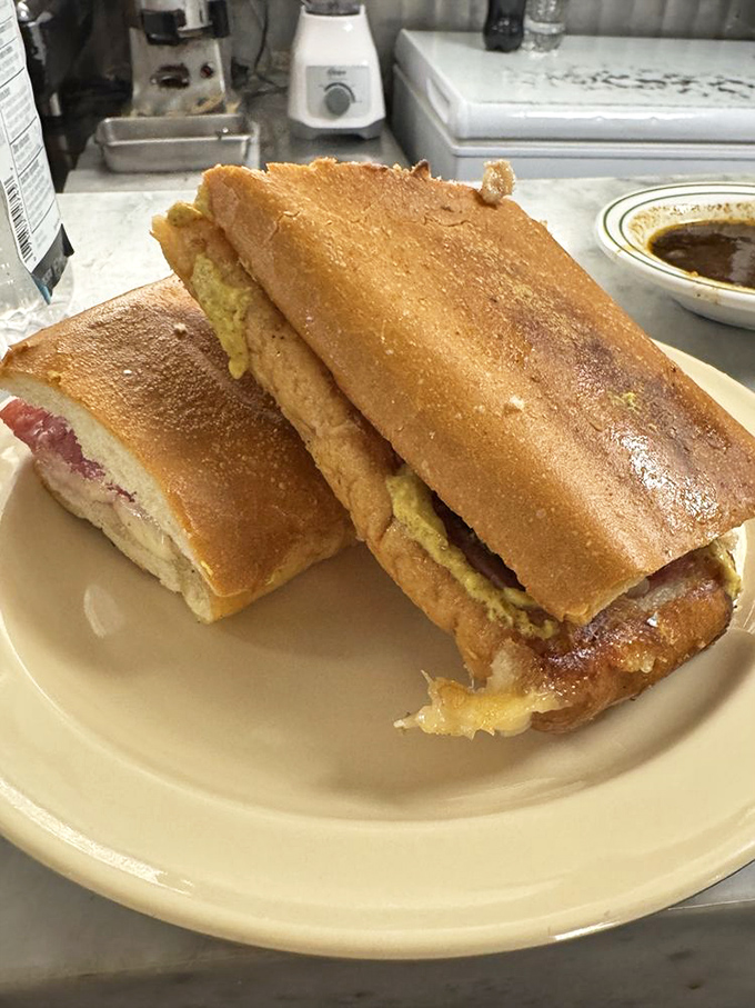 The Cuban sandwich: where pork, ham, and cheese perform a three-part harmony. It's like salsa for your mouth, minus the fancy footwork.