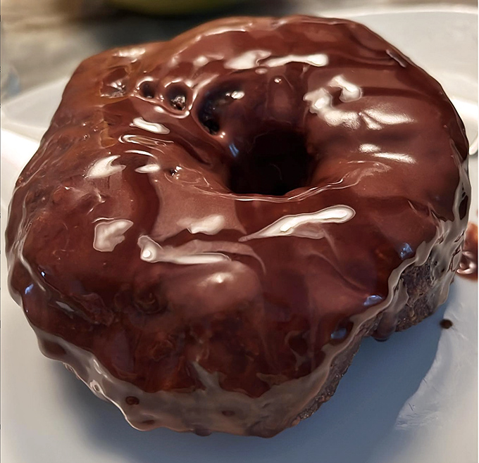 Chocolate lovers, rejoice! This glossy, glazed donut is like a ring of happiness, waiting to make your day a whole lot sweeter.