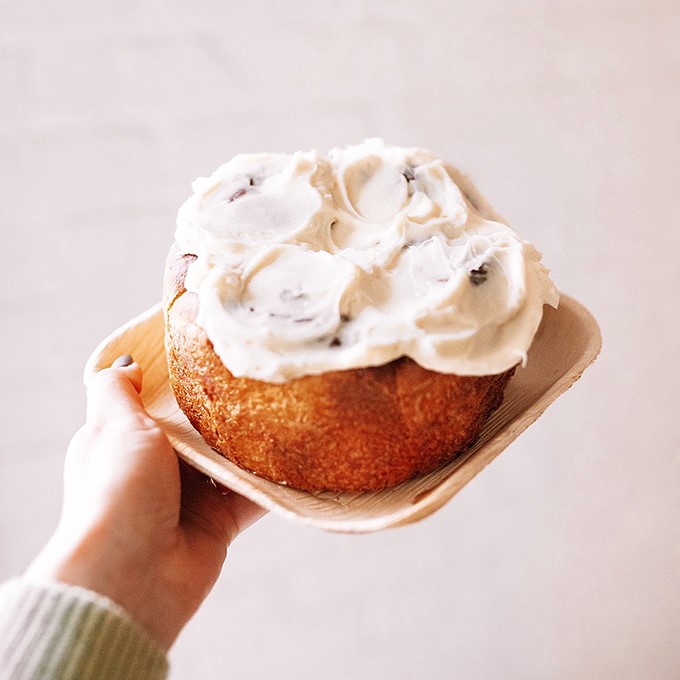Pillowy perfection! This cinnamon roll is so fluffy, it might just float away if not anchored down by that gloriously gooey frosting.
