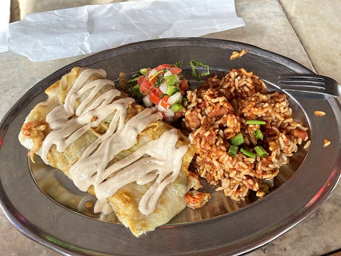 Who needs a burrito when you can have these? Stuffed to the gills and drizzled with sauce, these enchiladas are a Cajun twist on Tex-Mex.