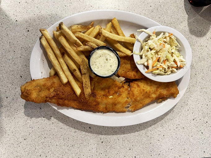 Golden treasures from the sea: Crispy, flaky fish and chips that would make Neptune himself swap his trident for a fork.
