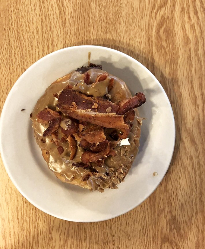 Who knew heaven could fit on a plate? This maple bacon creation is the doughnut of your wildest breakfast fantasies.