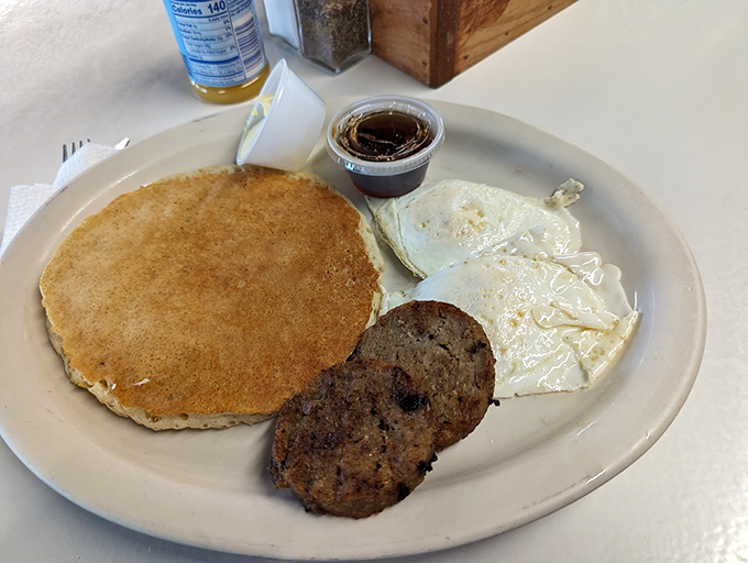 The pancake that launched a thousand satisfied sighs. Golden-brown, perfectly round, with that sausage patty playing the perfect supporting role.