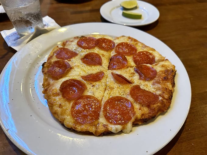 Pizza perfection! This pie's got more circles than a geometry textbook, but trust me, it's way more fun to study.