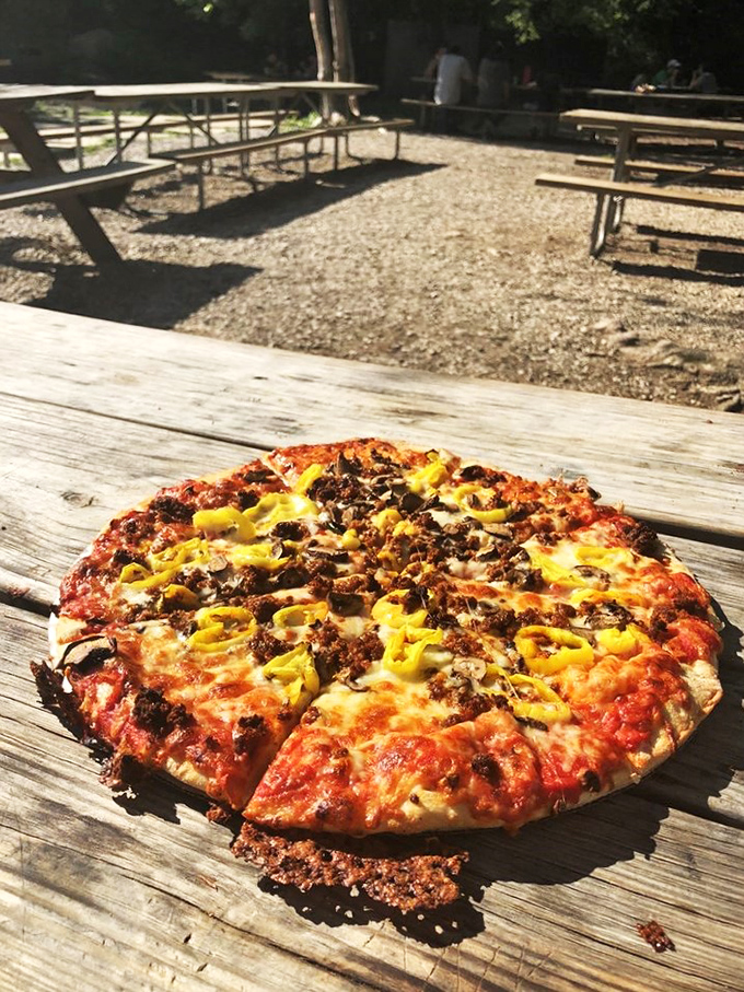 Pizza perfection in the great outdoors. This pie could make even the most dedicated trail mix enthusiast rethink their life choices.