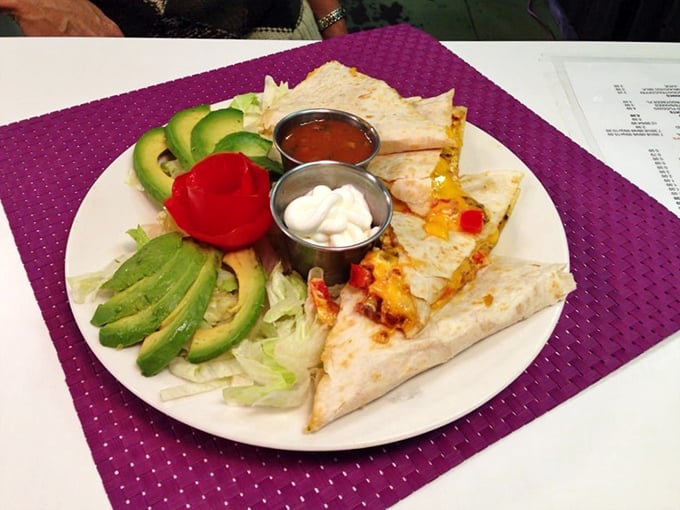 Quesadilla or work of art? This colorful plate is a fiesta for your eyes and your stomach. With fresh avocado and vibrant salsas, it's like a Mexican vacation without leaving Kansas.