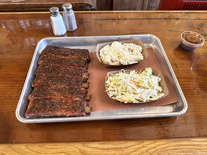 A trifecta of temptation! Ribs, slaw, and potato salad - the barbecue equivalent of winning the culinary lottery.