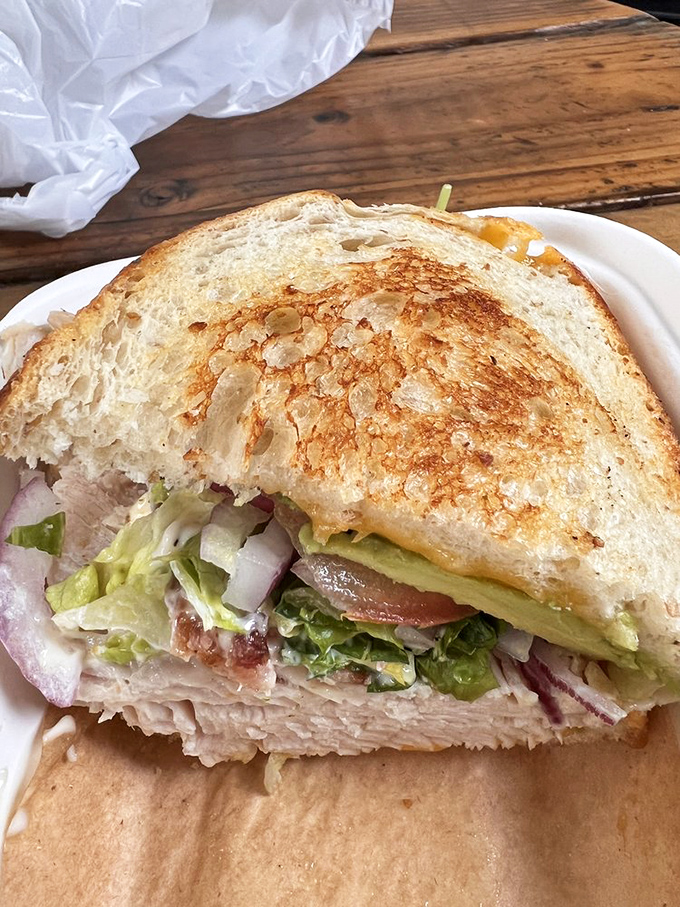 Behold, the roasted turkey sandwich that puts Thanksgiving to shame. It's like a warm hug from your grandma, if your grandma was a gourmet chef.