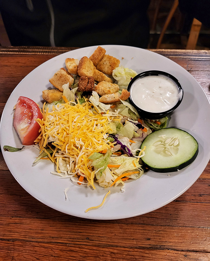 Who says you can't make friends with salad? This colorful ensemble is like a party on a plate, complete with crunchy croutons as the VIP guests.