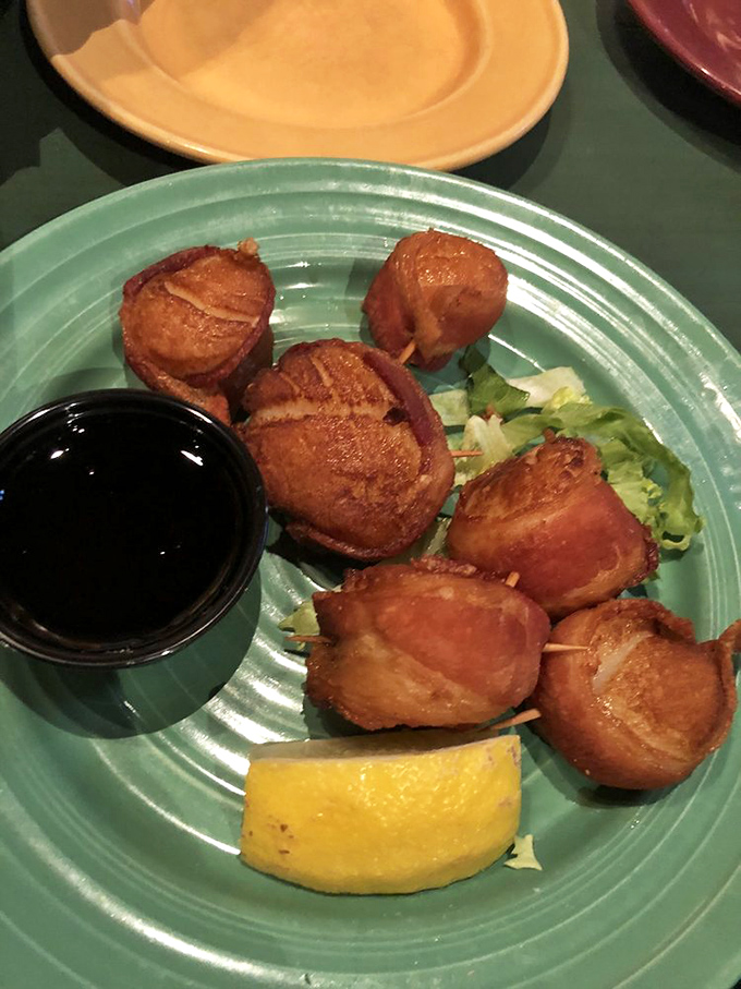 Golden-brown perfection! These bacon-wrapped scallops are like little flavor bombs, ready to detonate on your taste buds.