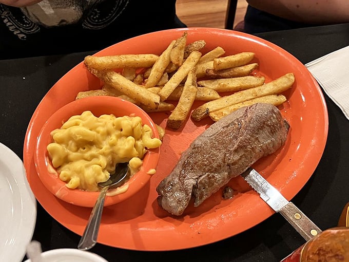Steak so tender, it practically cuts itself. Paired with mac and cheese that's creamier than a 1950s crooner's voice. Comfort food jackpot!