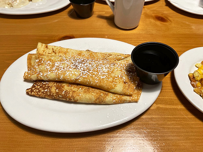 Pancakes or works of art? These golden beauties are so perfectly rolled, they could moonlight as Scandinavian architecture if they weren't so darn delicious.