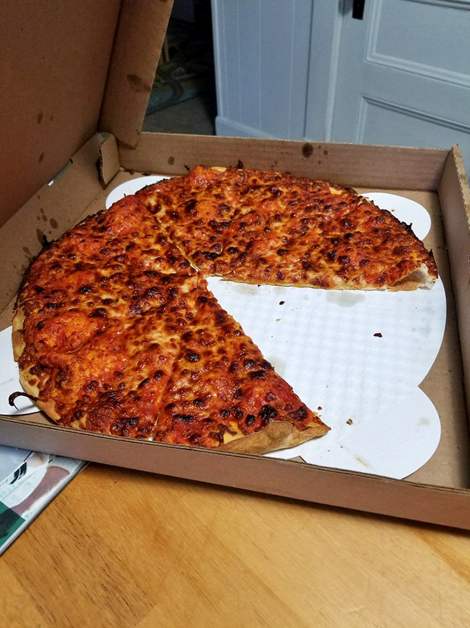 Simplicity, thy name is perfection. This classic pie showcases why sometimes, less truly is more in the pizza universe.