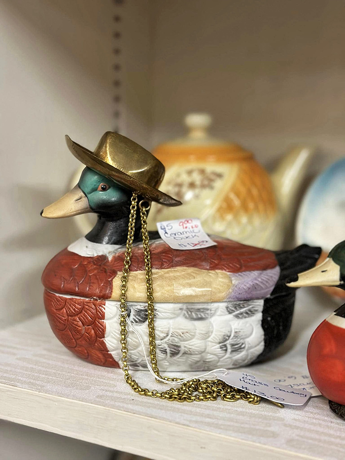 The dapper duck decoy sports a gold hat and chain that screams "I'm not just waterfowl, I'm sophisticated waterfowl."