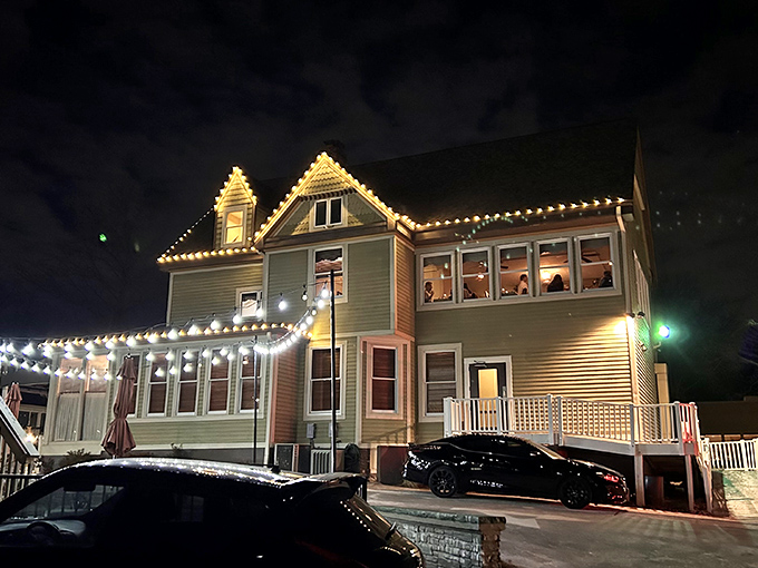Citizen Kane's after dark: Where steaks and stars align! This Victorian beauty transforms into a carnivore's castle under the night sky.