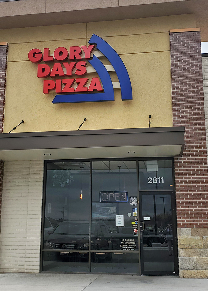 Glory Days' bold red sign promises a nostalgic pizza experience that delivers on both flavor and memories.