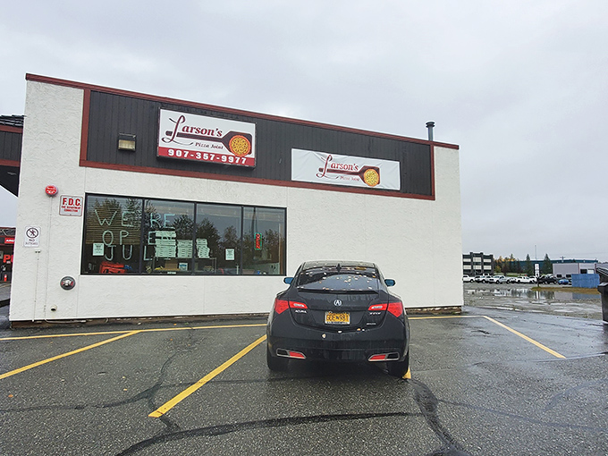 Larson's Pizza Joint: No frills, all thrills! This humble exterior hides a world of cheesy wonders that would make Wallace and Gromit swoon.