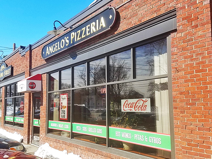 Coca-Cola signs and pizza pies, Angelo's serves up a slice of Americana with a generous helping of cheese on top.