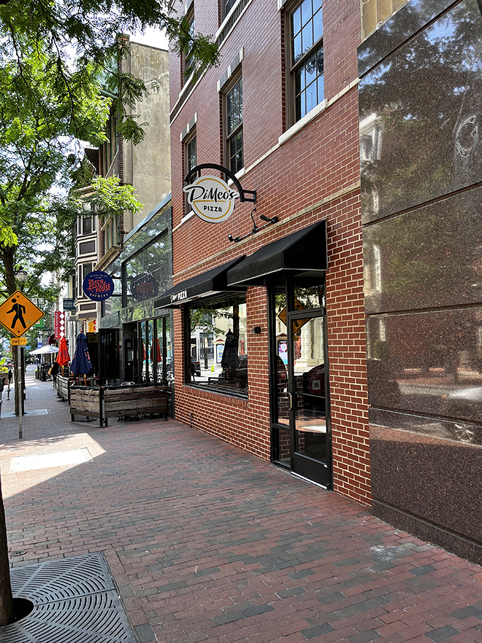 The bicycles parked outside DiMeo's tell you everything: people will happily pedal miles for pizza this authentic.