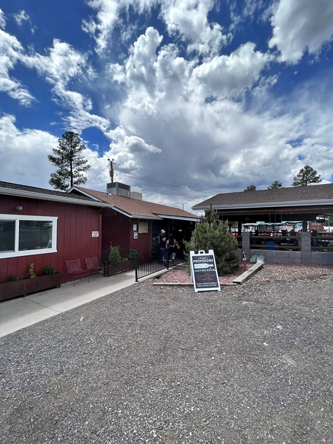 The mountain backdrop and rustic charm create the perfect setting for pizza that tastes like it was made by forest elves with culinary degrees.