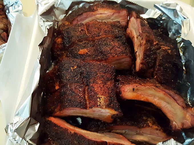 Rib nirvana achieved! This platter is proof that sometimes, the best things in life come slathered in sauce and paired with crispy sides.