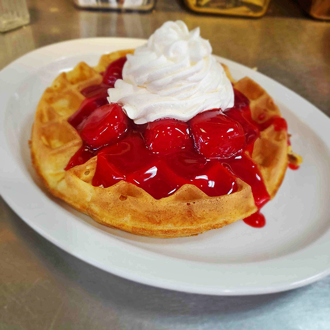 Waffle perfection achieved! This ruby-red masterpiece could make even the Grinch's heart grow three sizes. It's not just a meal, it's a work of art.