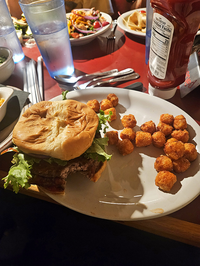 Ahoy, burger lovers! This hearty patty and its crispy sidekicks are here to keep you anchored while you float in a sea of tiki delights.