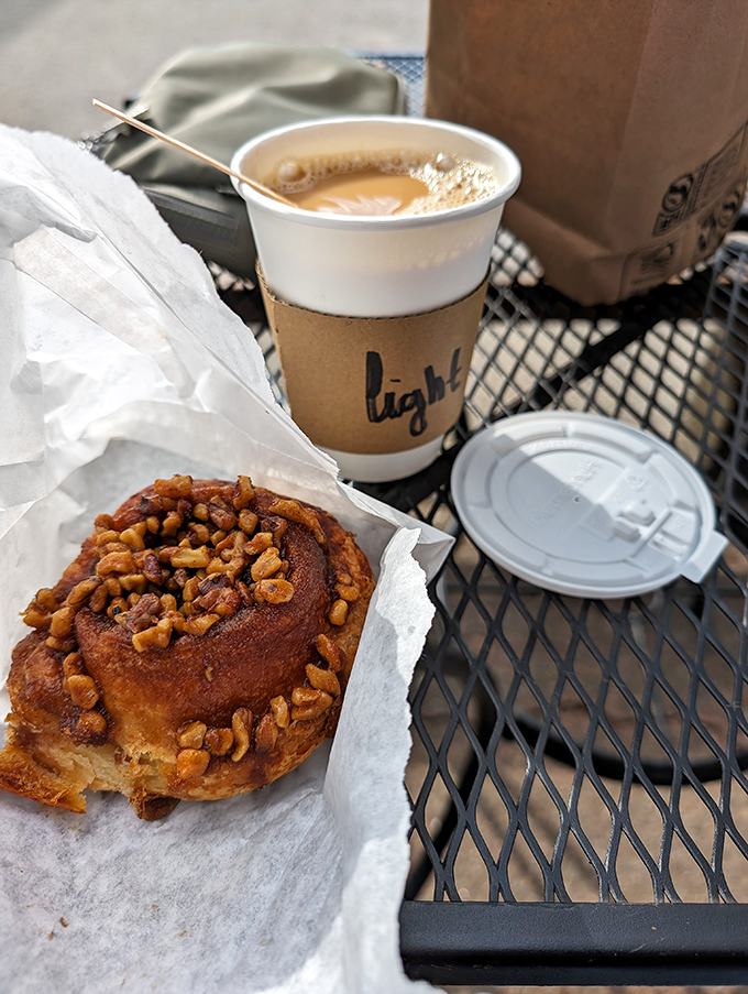The dynamic duo: a cinnamon roll that could make angels weep, paired with coffee strong enough to wake Rip Van Winkle.