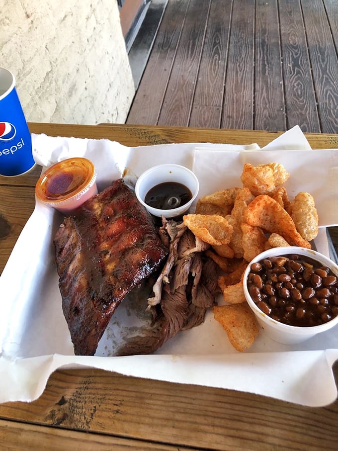 The holy trinity of BBQ: ribs, brisket, and sides that'll make your grandma jealous. It's a flavor explosion that'll have you seeing stars (and stripes).