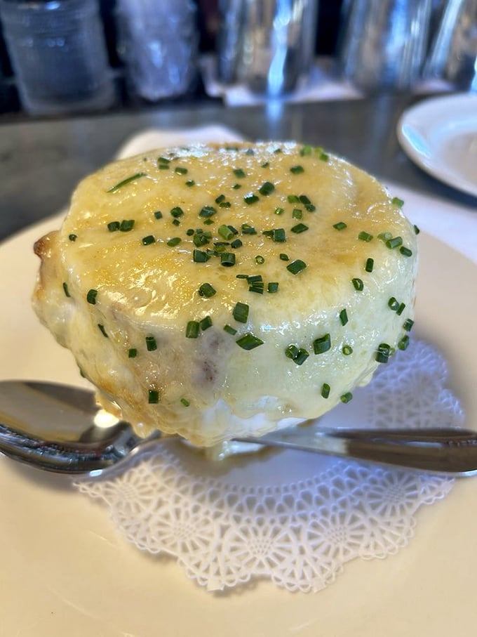 Houston, we have liftoff! This French onion soup's cheese cap is defying gravity and common sense in the most delicious way possible.