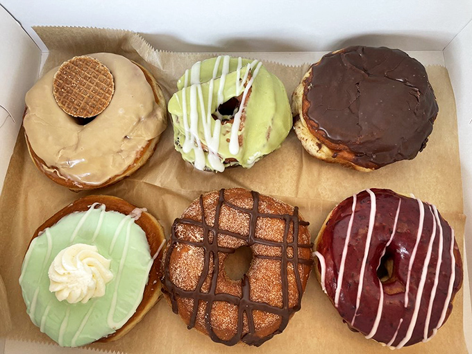 Feast your eyes on this trio of temptation. From classic glazed to gourmet creations, Good Dough's got all bases covered.