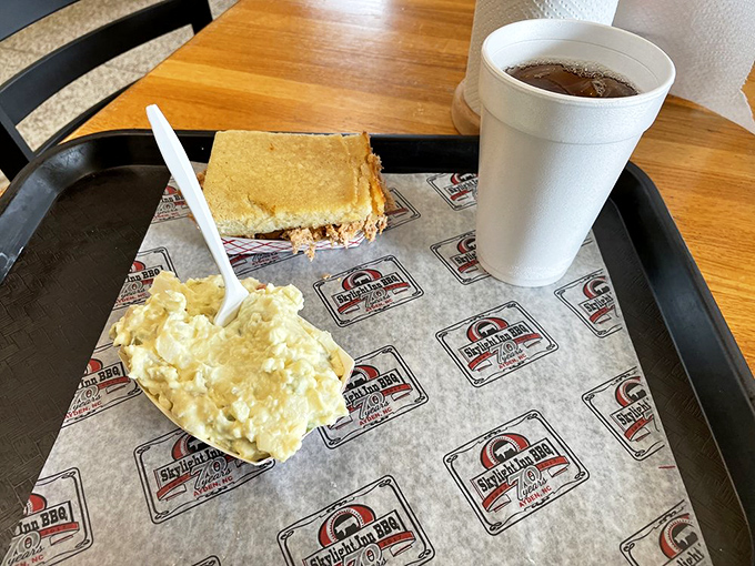 Simple pleasures presented simply: juicy chicken, perfectly smoky beans, and potato salad that generations of picnickers wish they could replicate.