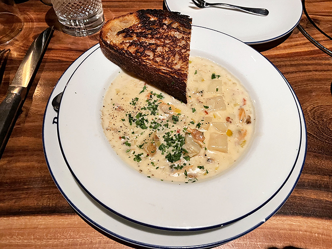 Toast to the coast! This New England clam chowder, paired with crusty bread, is like a warm hug from the Atlantic Ocean.