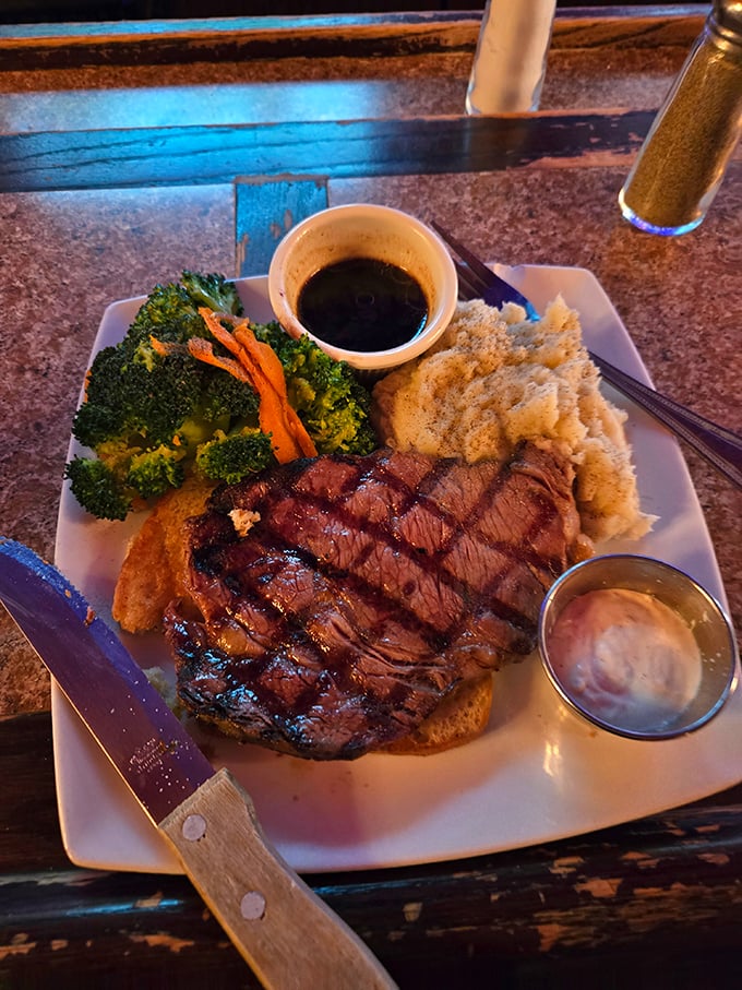 The holy trinity of dining satisfaction: perfectly cooked prime rib, creamy mashed potatoes, and broccoli that's there to make you feel virtuous.