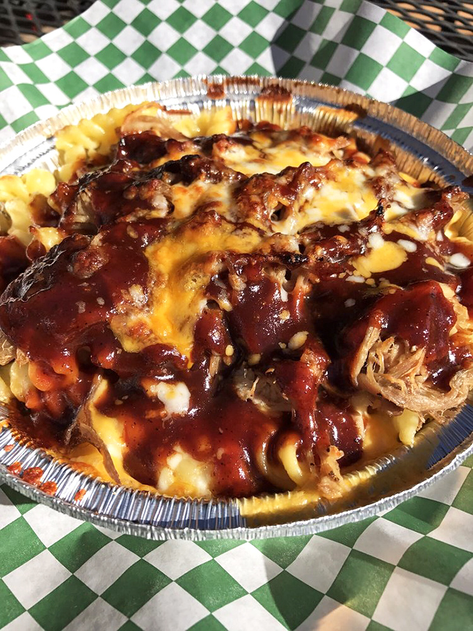 Pulled pork perfection meets mac and cheese magic. It's like a backyard BBQ and a fancy cheese shop had a delicious love child.